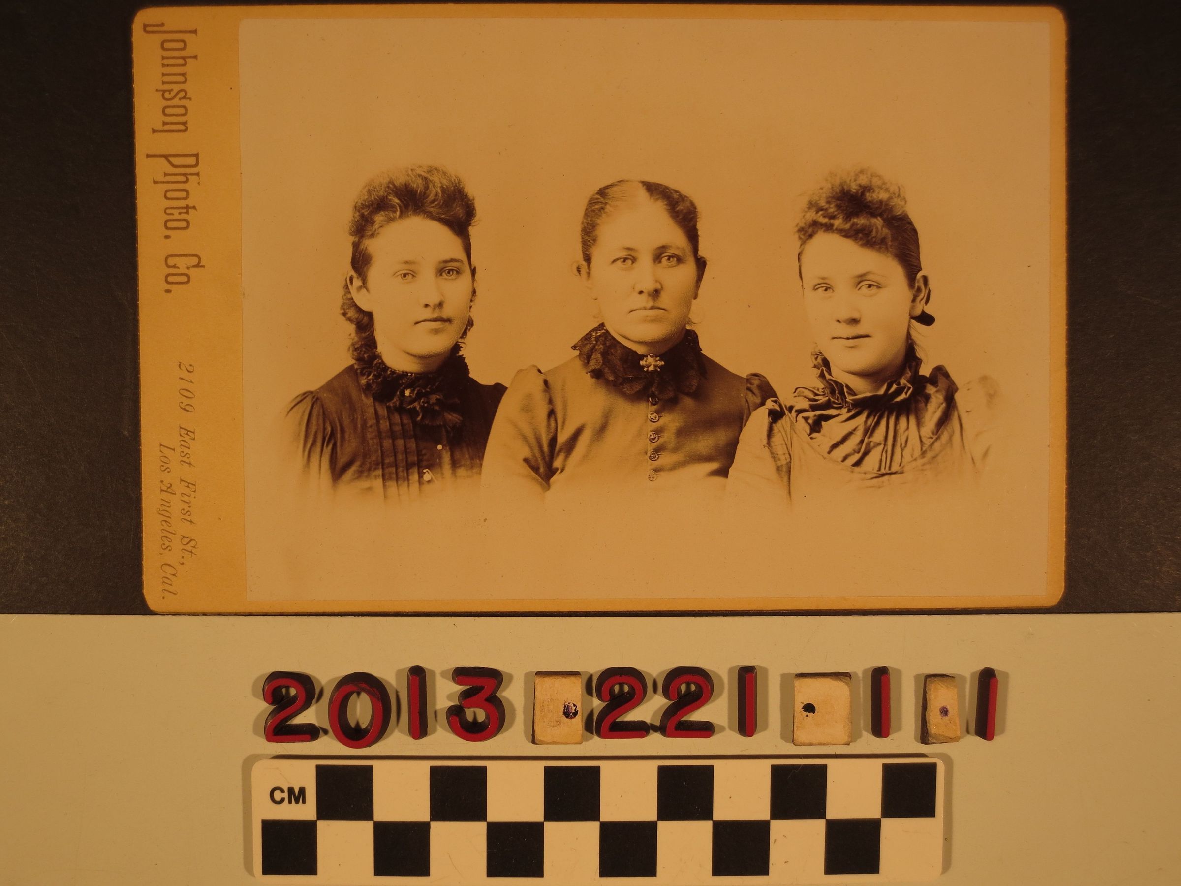 A cabinet studio portrait of a woman and two younger women, Johnson ...